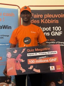 Remise du Jackpot de 100 millions GNF au grand gagnant du Quiz Megawin ...